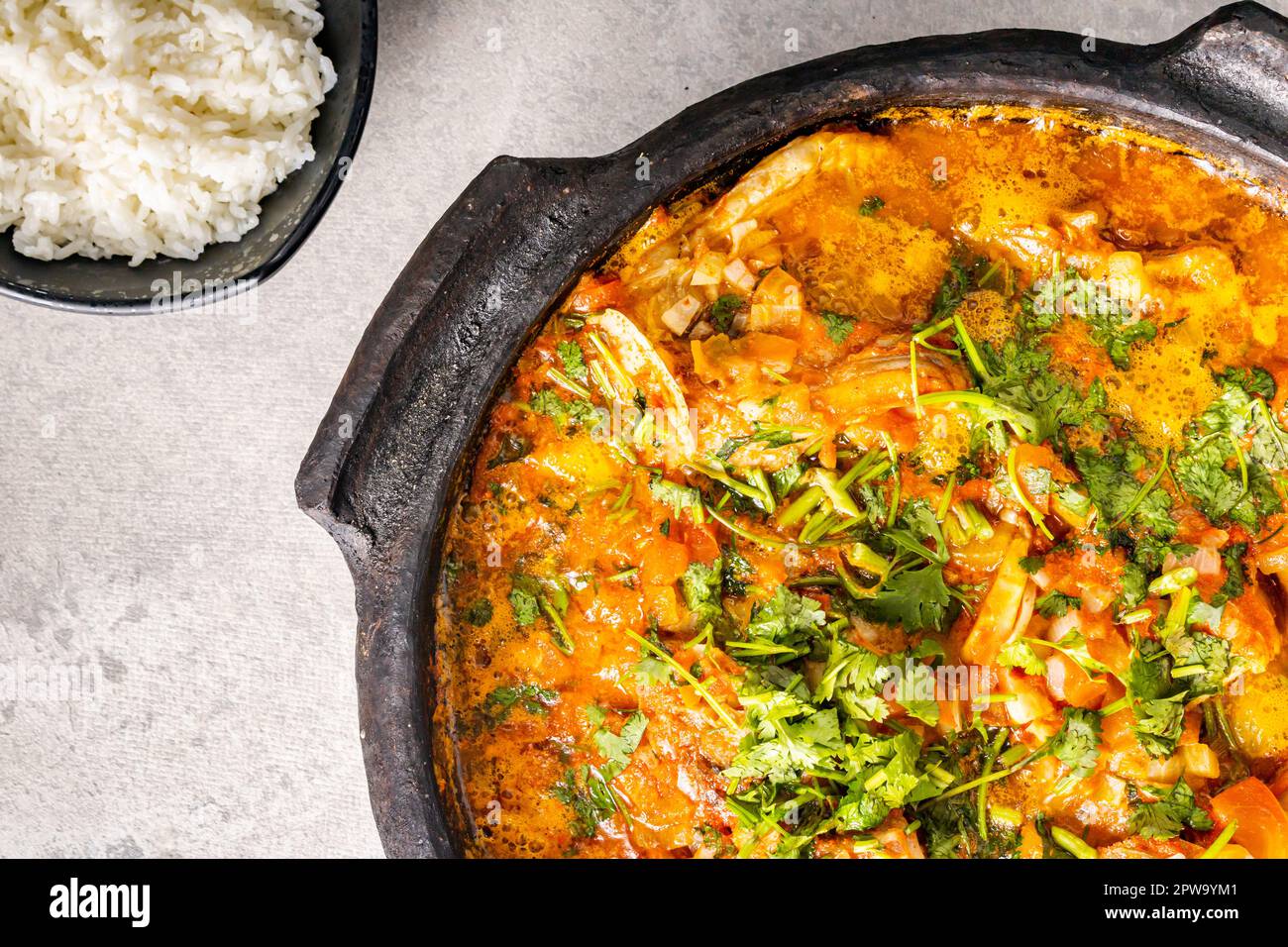 Delicious Brazilian fish moqueca with tomato, onion, olive oil ...