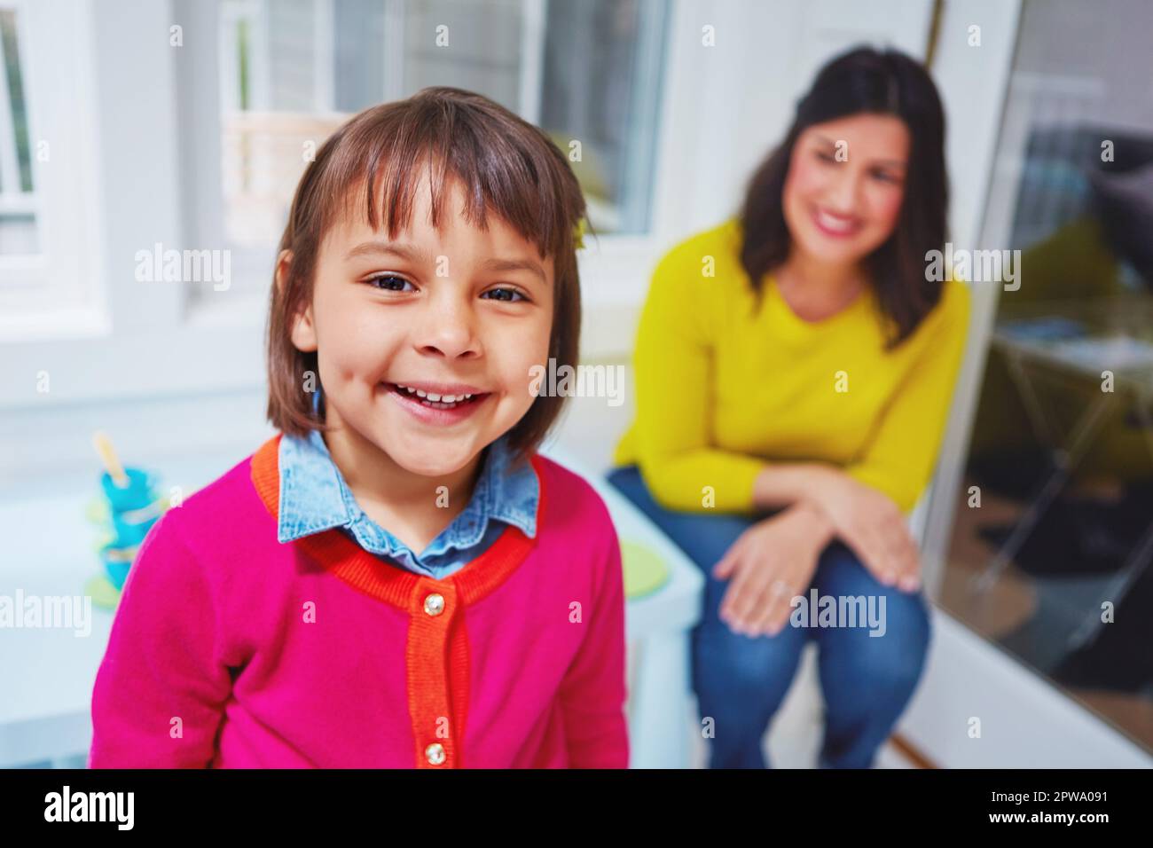 Mom makes sure we have a happy home. Portrait of an adorable little ...