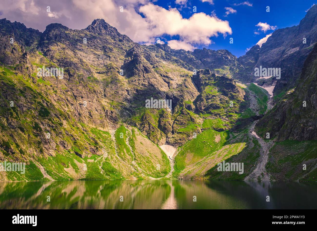 Beautiful lake in polish mountains in summer scenery. Black Pond is one ...