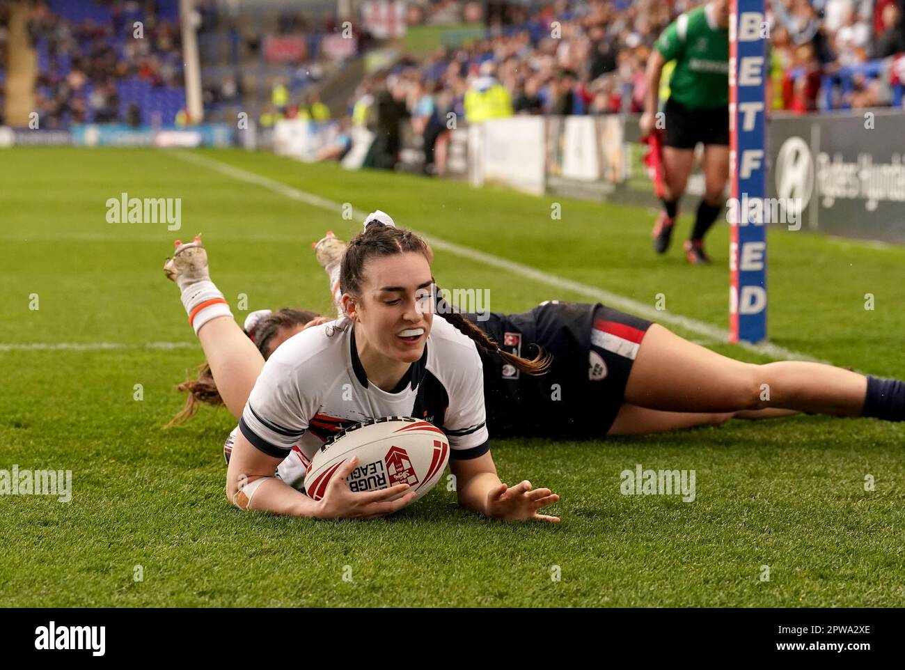 England's Leah Burke goes over for a try during the women's mid-season ...