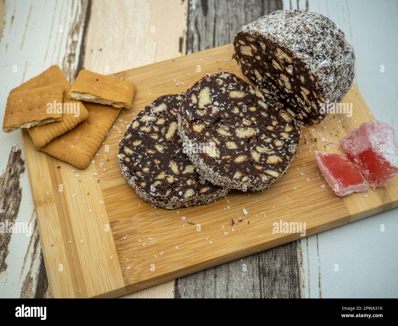 slices chocolate salami with biscuits on a cutting board with turkish ...