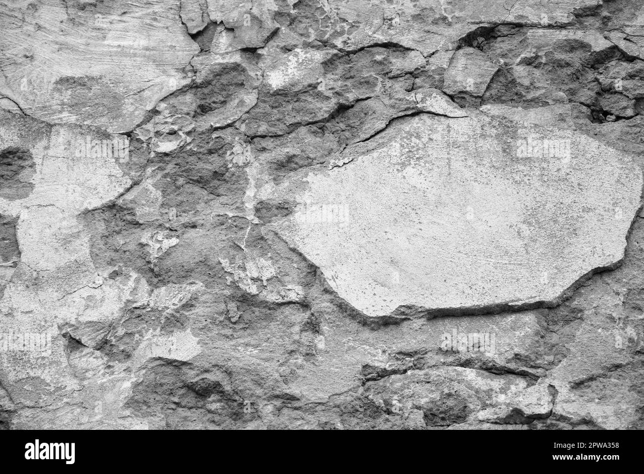 Texture of old stone wall with collapsed plaster. Background of shabby ...