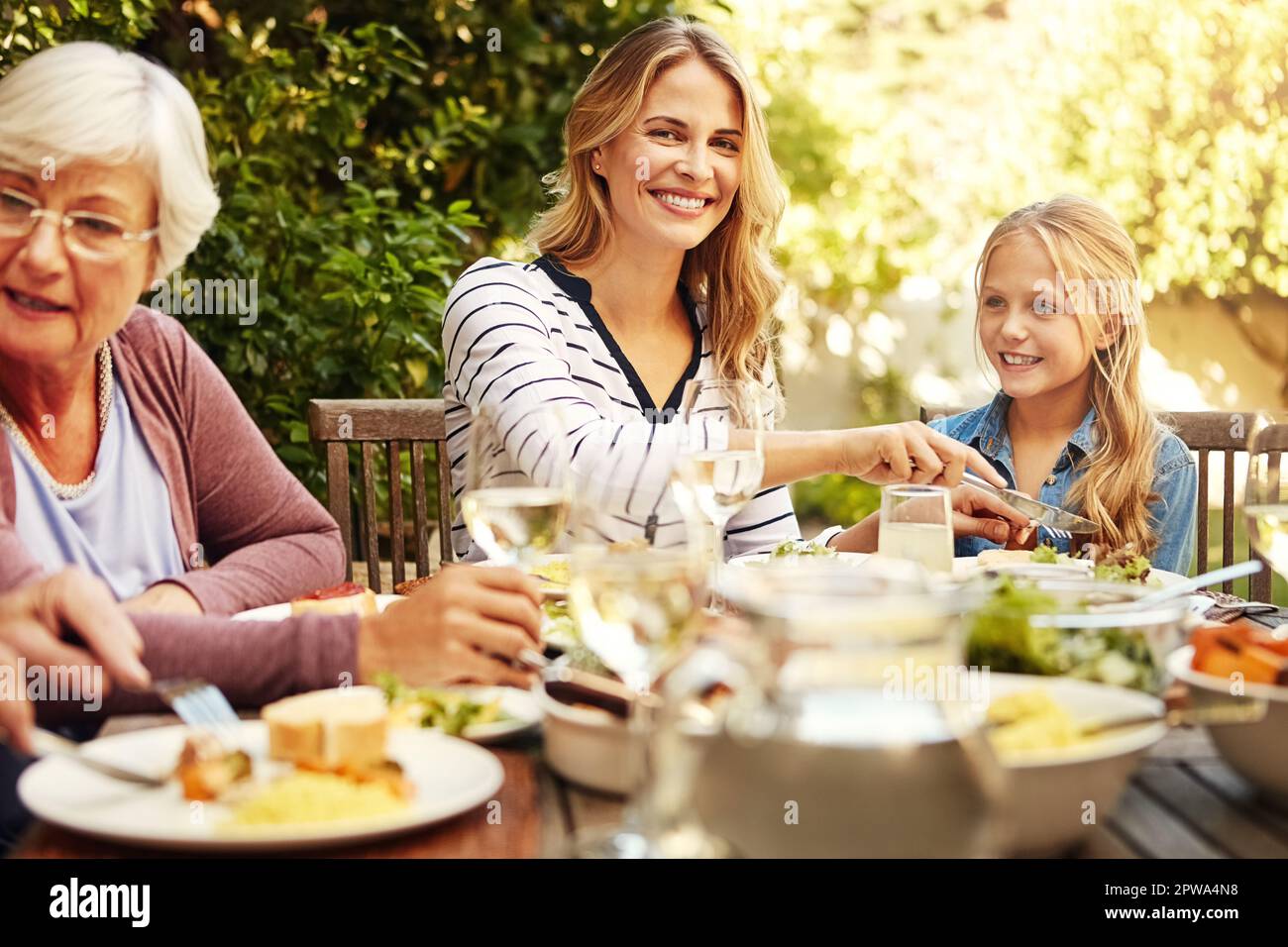 Our family gets together for lunch every month. a family eating lunch ...