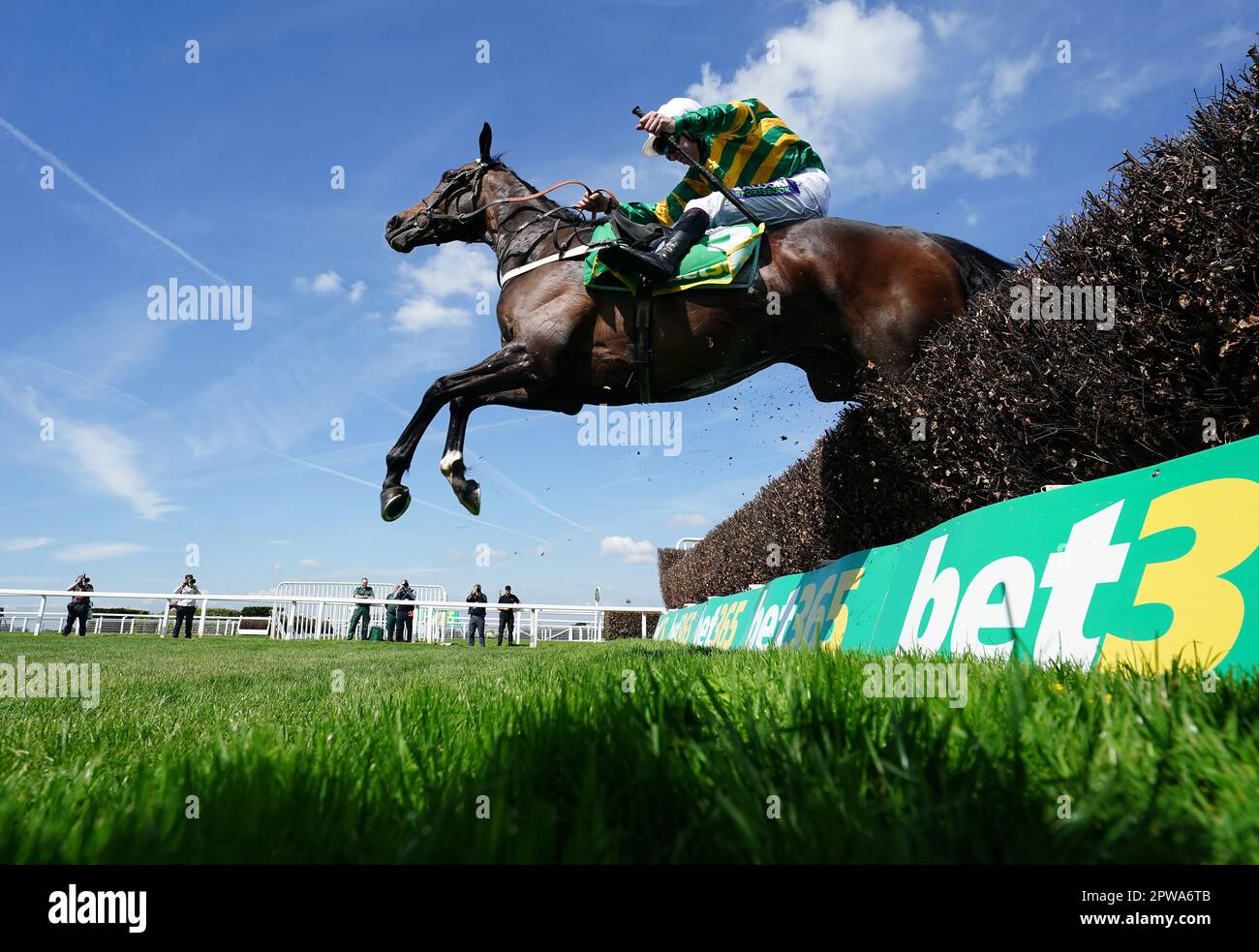 Jonbon ridden by jockey Aidan Coleman clear a fence on their way to ...