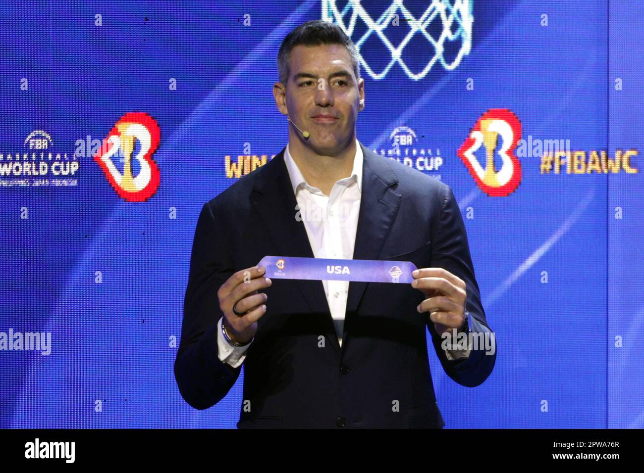 FIBA ambassador and Former NBA star Luis Scola shows the ticket for USA ...