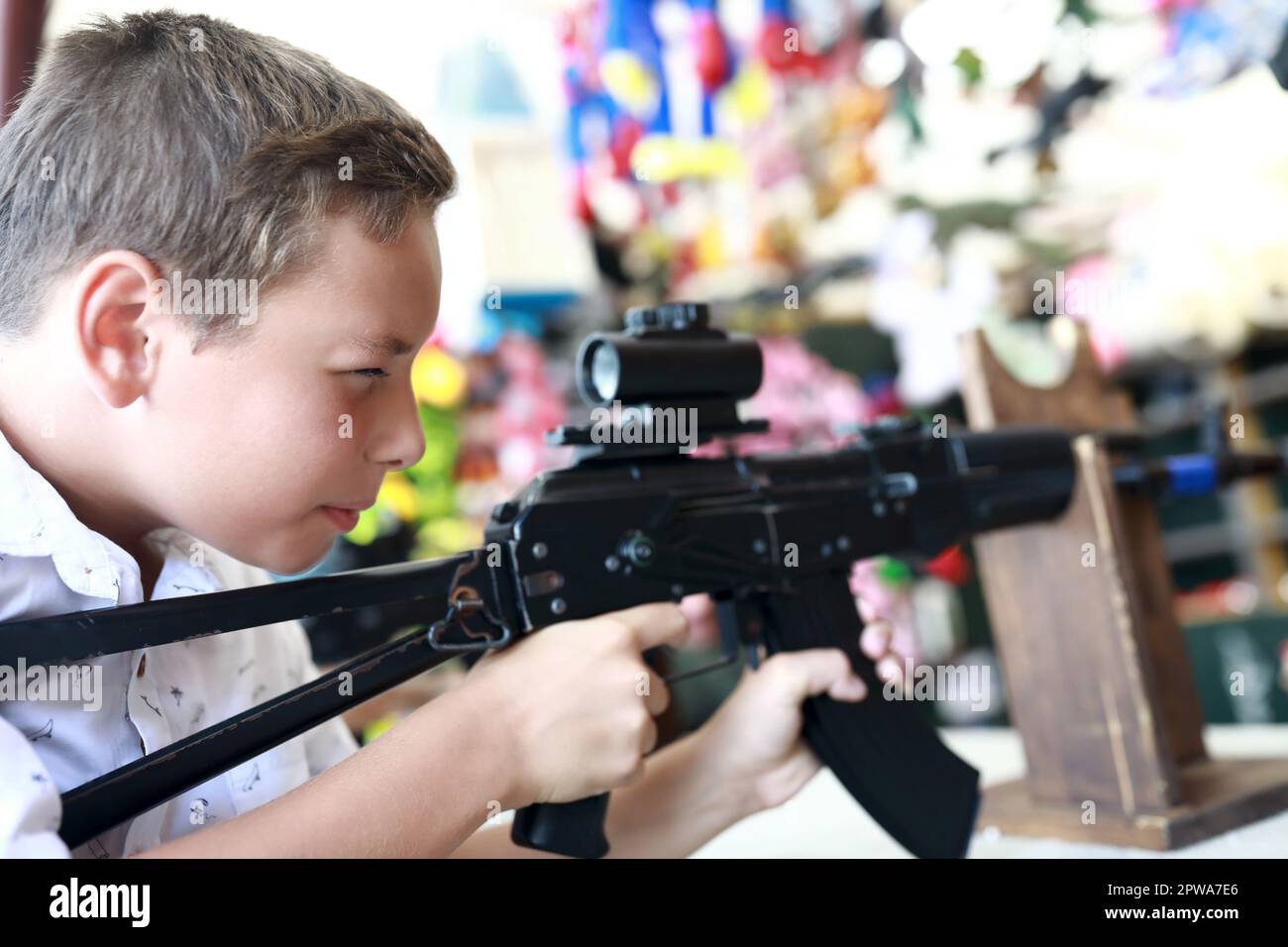 Child shoots air rifle in shooting range Stock Photo - Alamy