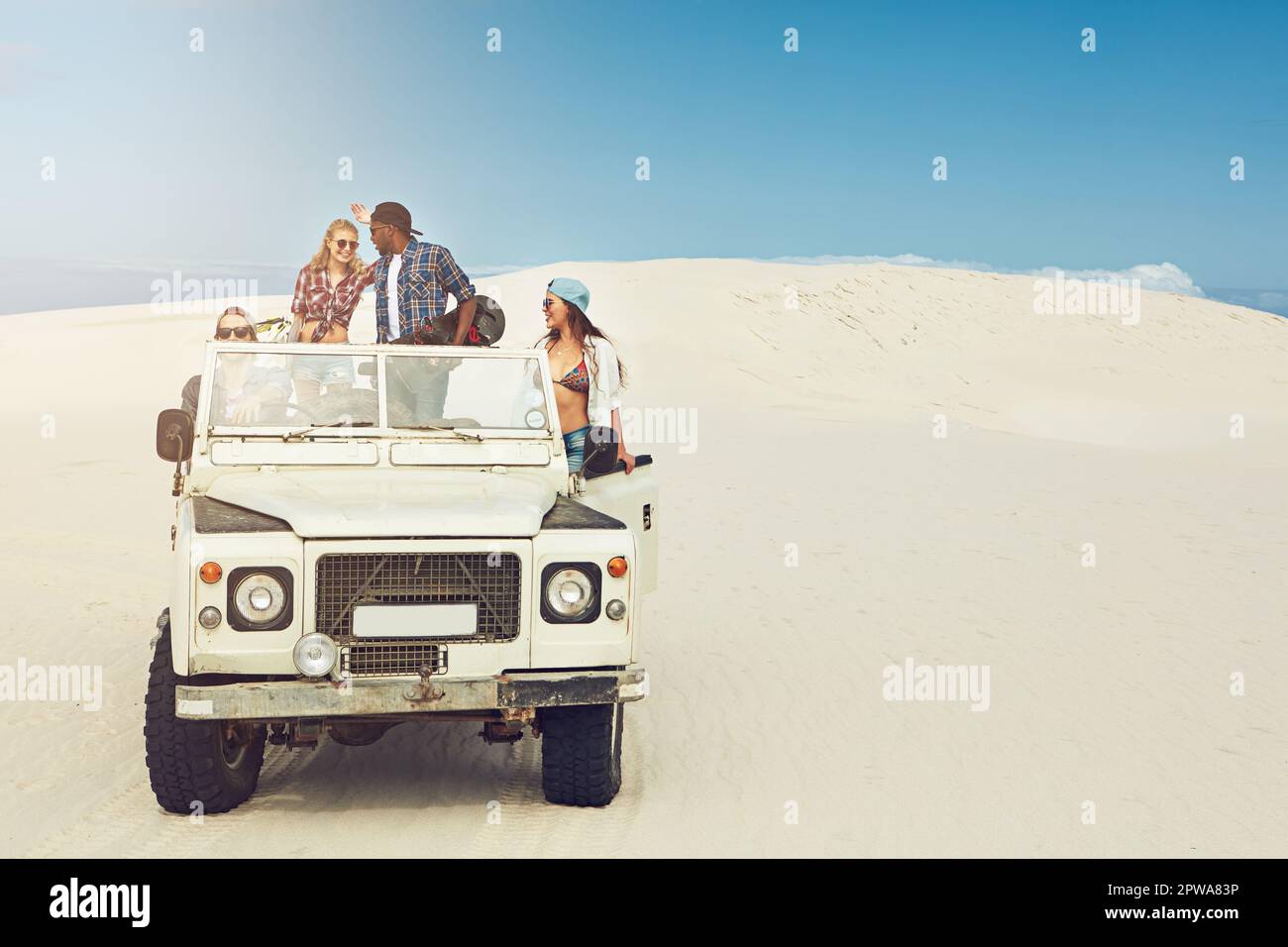 White, sandy desert dunes...the adventure awaits. a group of young ...
