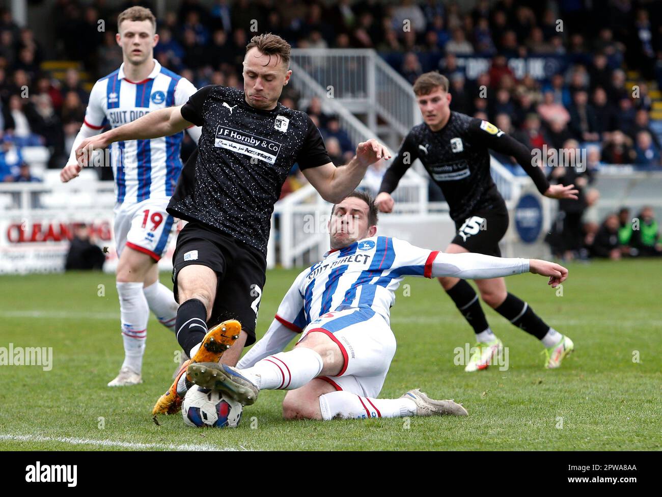 Barrow's George Ray (left) and Hartlepool United's Matthew Dolan battle ...