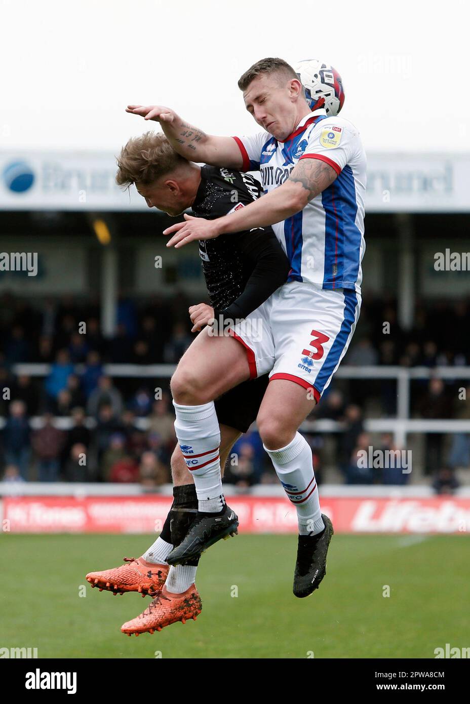 Barrow's Harrison Neal (left) and Hartlepool United's David Ferguson ...