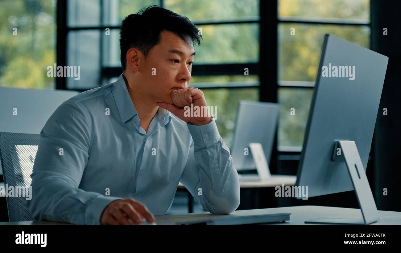 Asian businessman korean man work online at workplace difficult hard ...