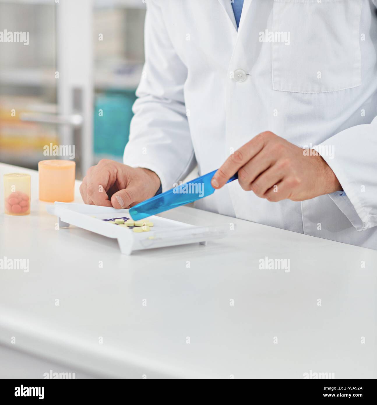 Accuracy is important. a pharmacist counting medication. All products ...
