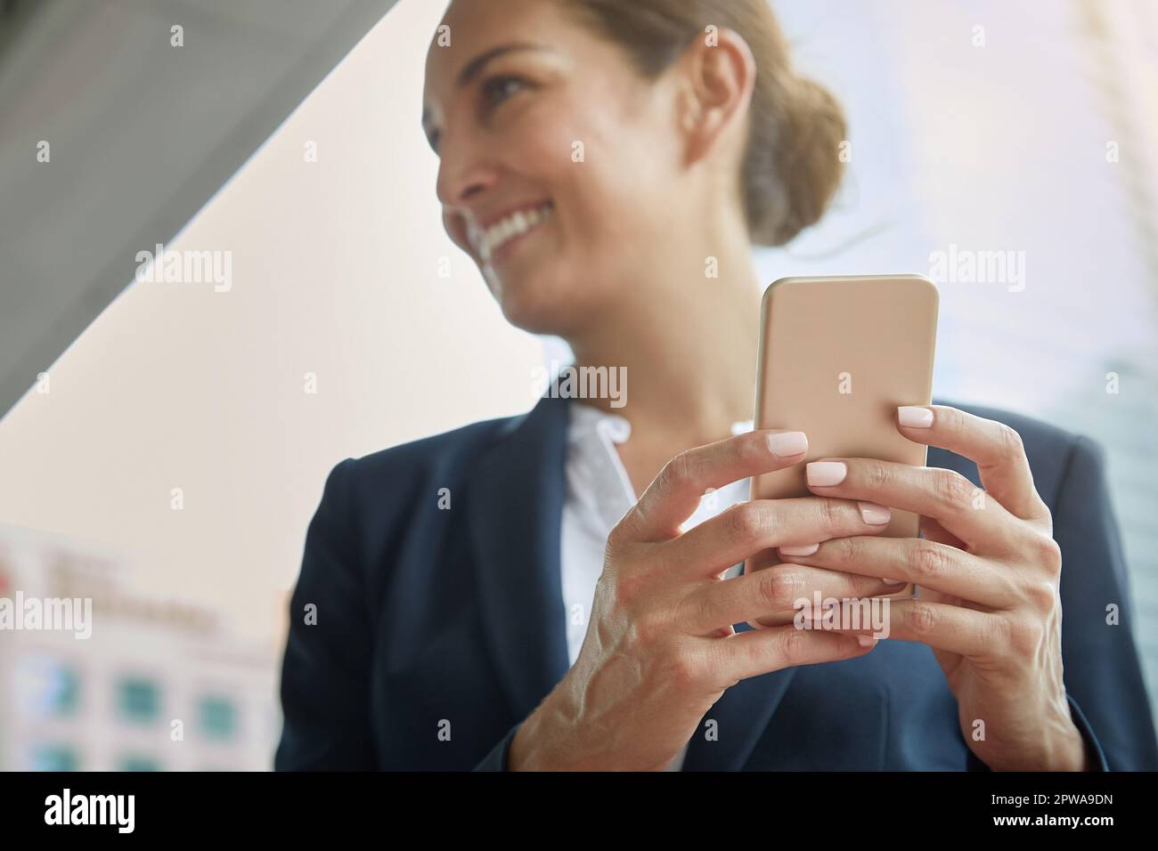 Making new business connections. a young businesswoman using a ...