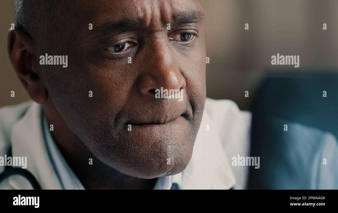 Medical worker mature african man surgeon professional radiologist look ...