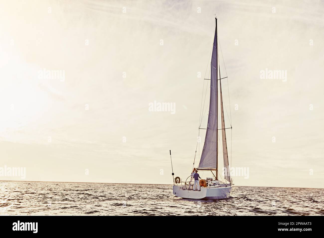 Sailing is exciting and fun. a couple out sailing on a yacht Stock ...