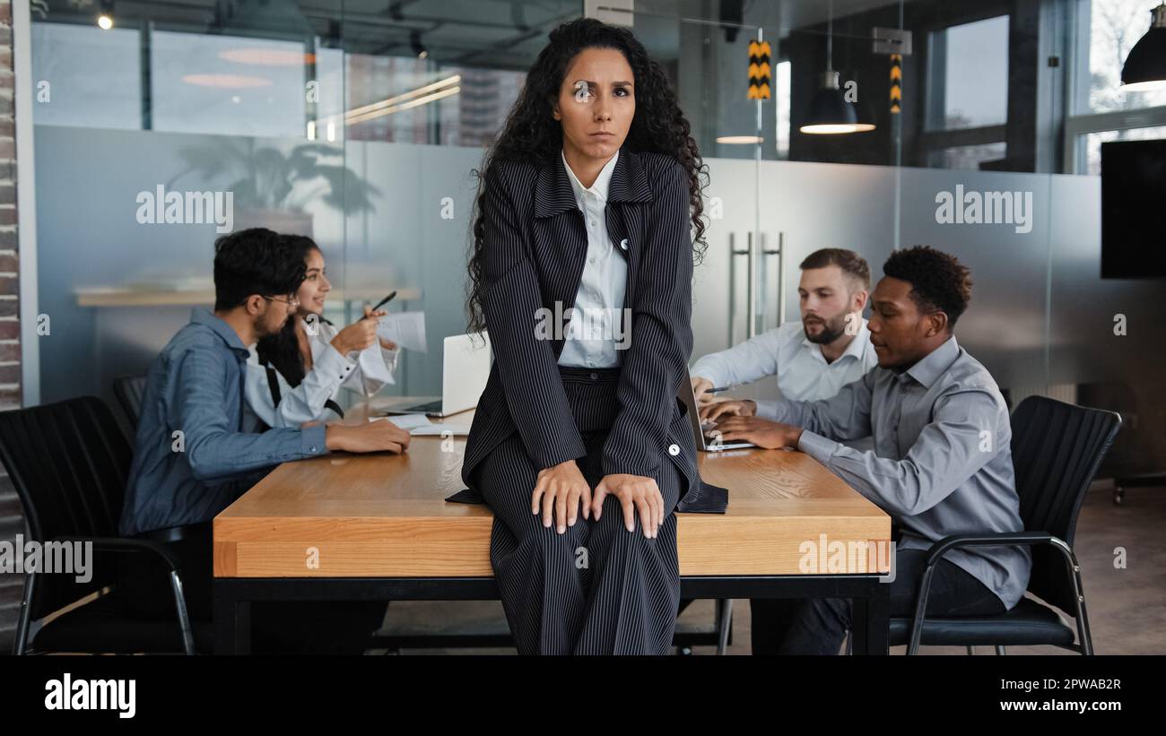 Worried upset leader woman tired worker businesswoman sitting on table ...