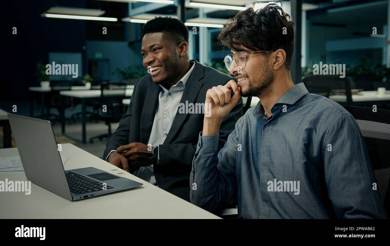 Two businessmen business partners office African American man client ...