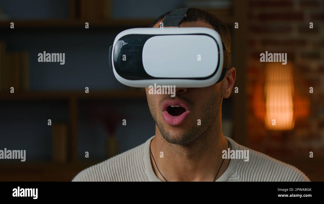 African american latino man gamer in VR goggles play game use virtual ...