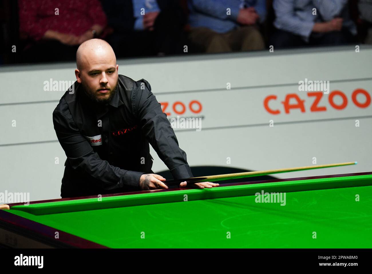 Luca Brecel in action against Si Jiahui (not pictured) on day fifteen ...