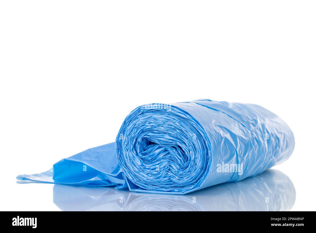 One pack of plastic garbage bags, macro, isolated on white background ...