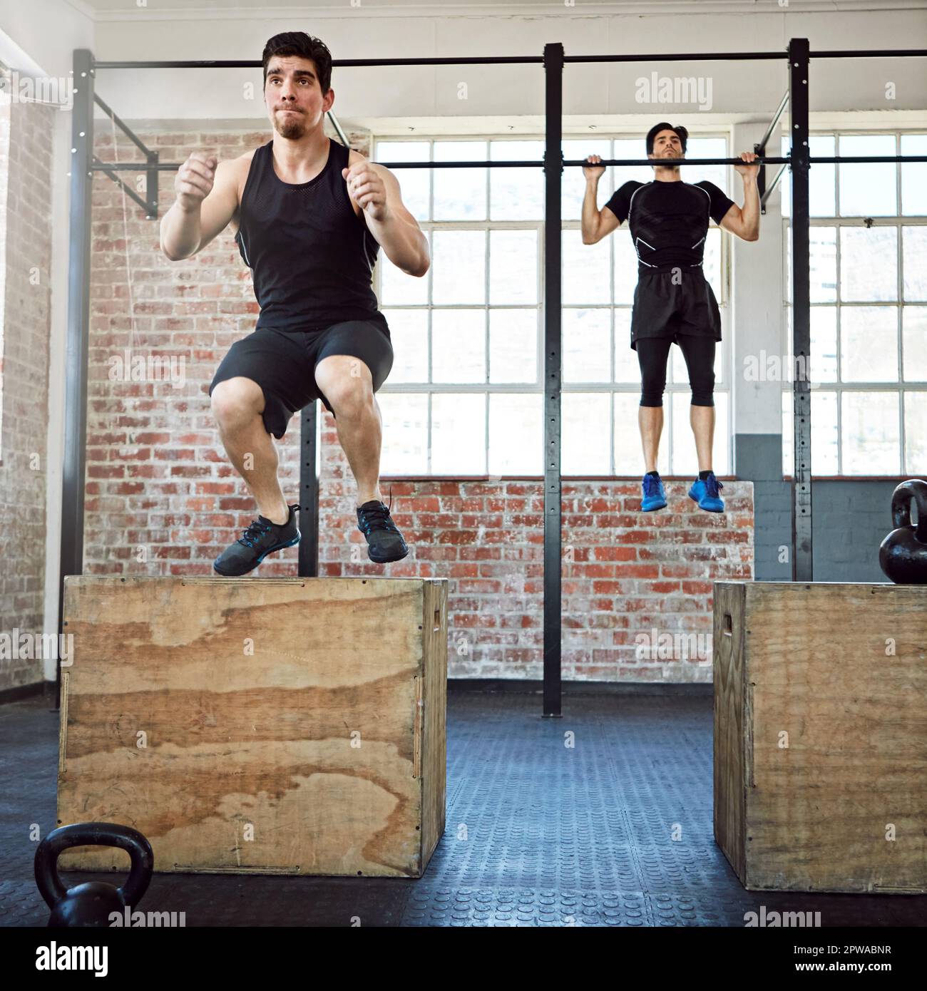 Working out simplified. a young men working out in the gym Stock Photo ...