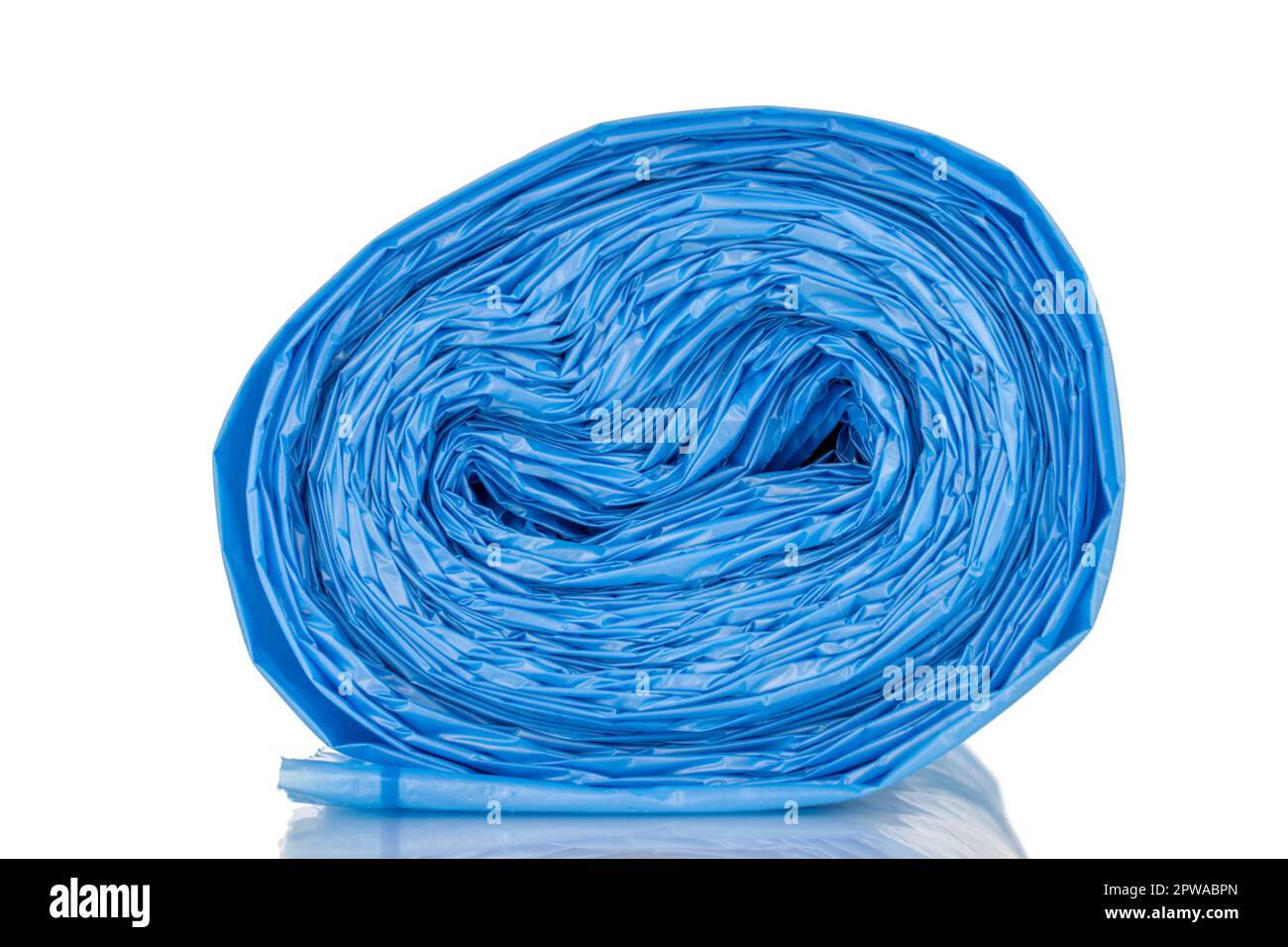 One pack of plastic garbage bags, macro, isolated on white background ...