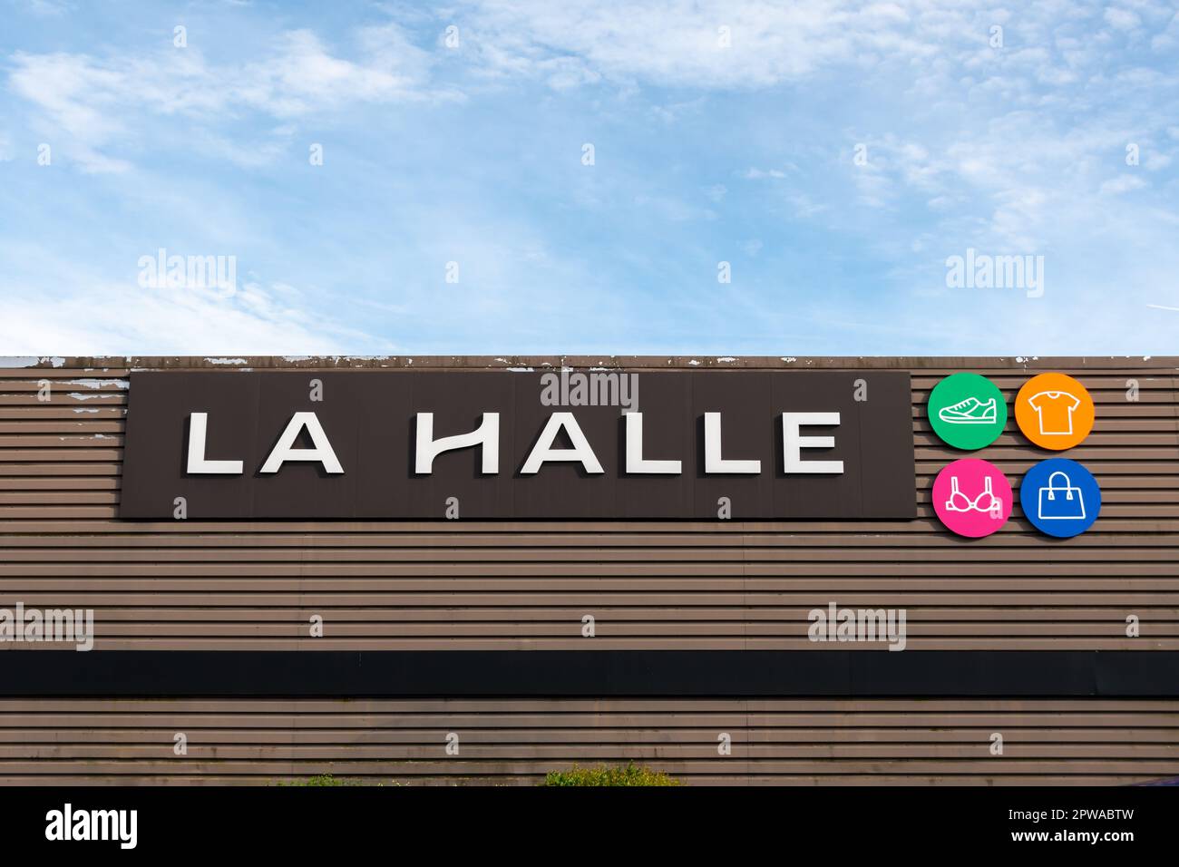 Sign and logo of a La Halle retail store, a French company specializing ...
