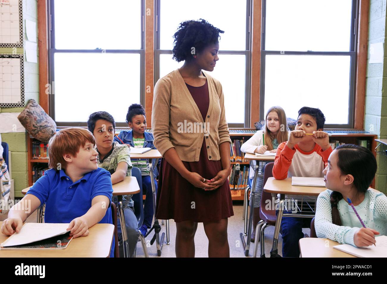 All of life is a constant education. a teacher in a classroom with her ...