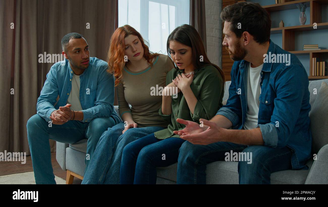 Sad crying woman sharing life problem grief with friends multiracial ...