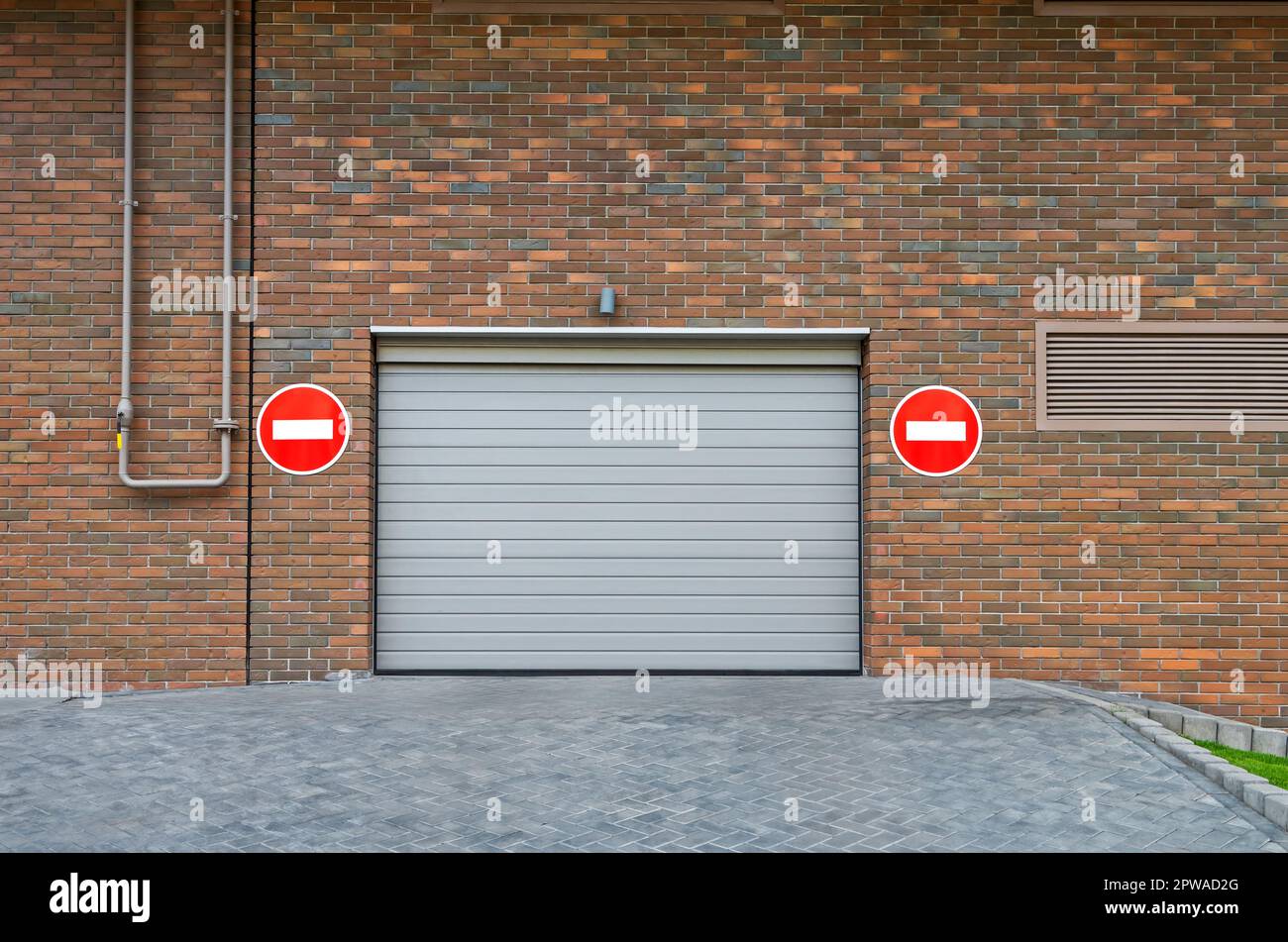 Automatic electric roll-up gate. Departure from the underground parking ...