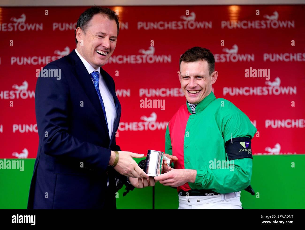 Jockey Paul Townend is presented with an award by Minister for ...