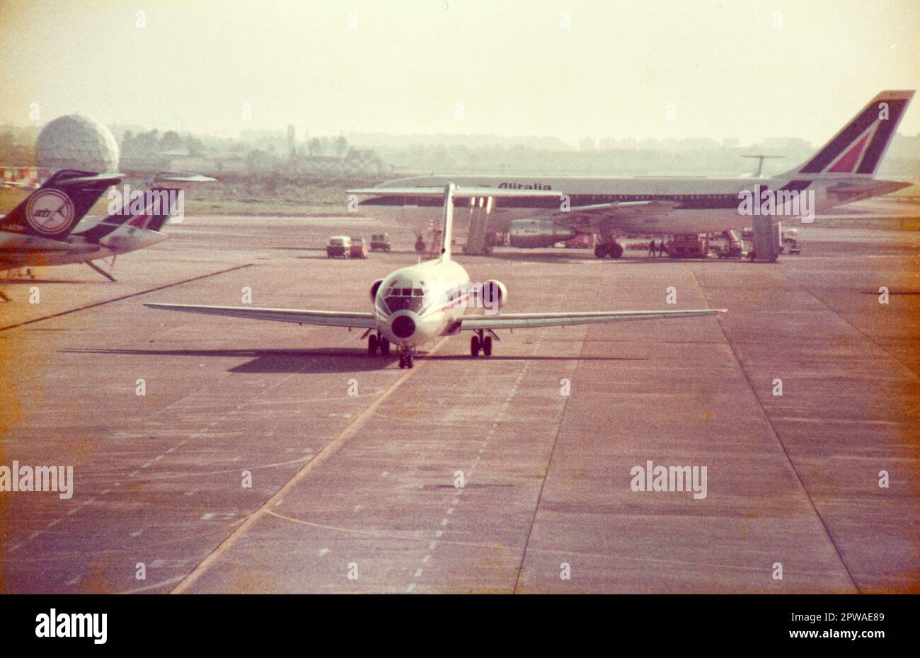 A JAT (Jgoslovenski Aero Transport) DC9-30 taxiing to gate at Linate ...