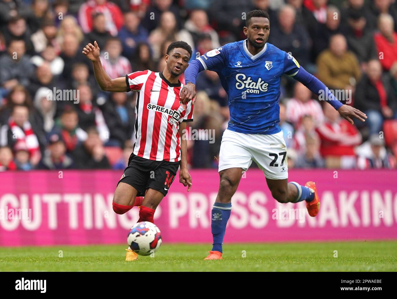 Sunderland's Amad Diallo (left) and Watford's Christian Kabasele battle ...