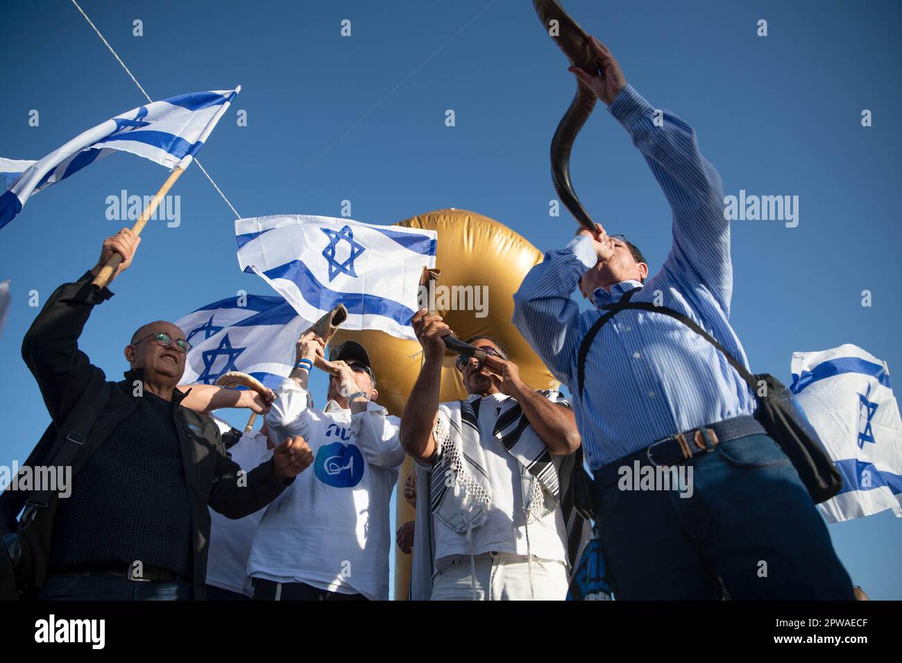 A group of reform supporters use the Shofar in protestation against the ...