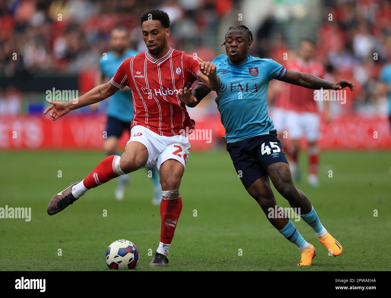 Bristol City's Zak Vyner (left) and Burnley's Michael Obafemi battle ...