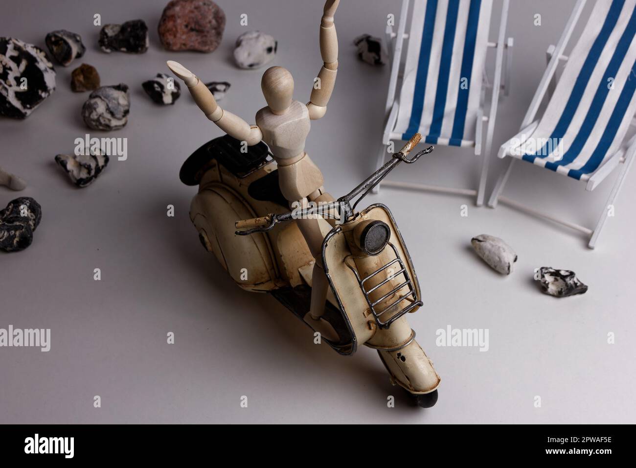 detailed view of a motor scooter model combined with a puppet on a ...