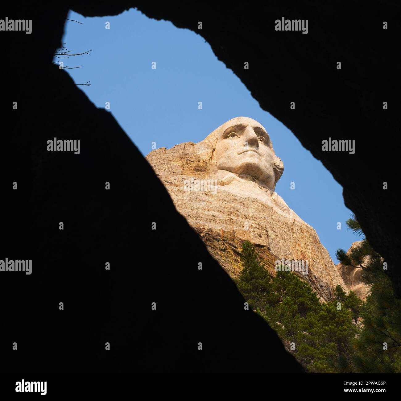 The carved face of George Washington peers down through a crevice in ...