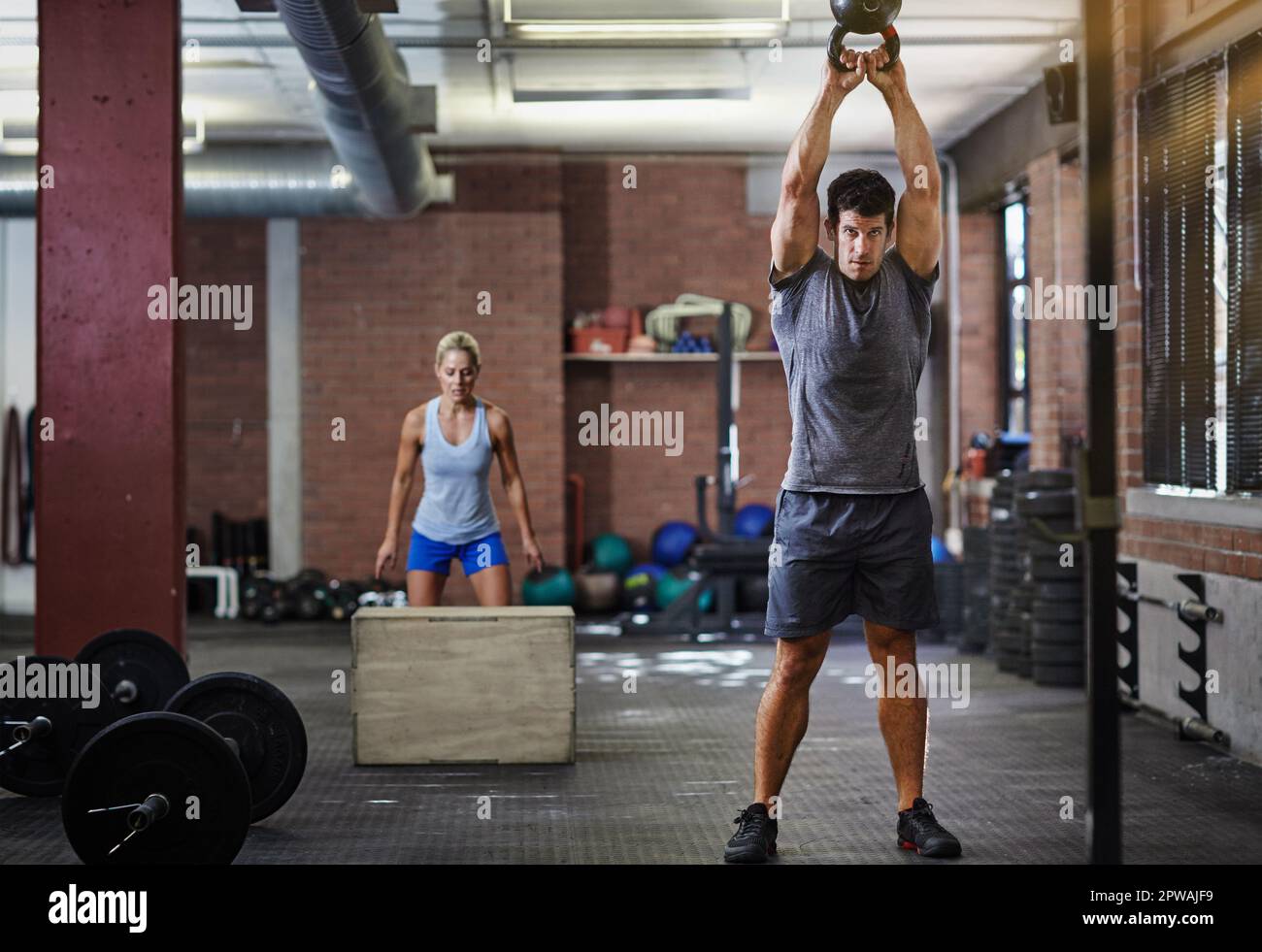 Theyre making this workout count. two people working out with ...