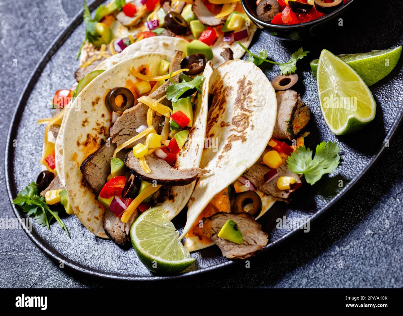 Grilled Steak Tacos with olives, tomatoes, red onion, avocado, cilantro ...
