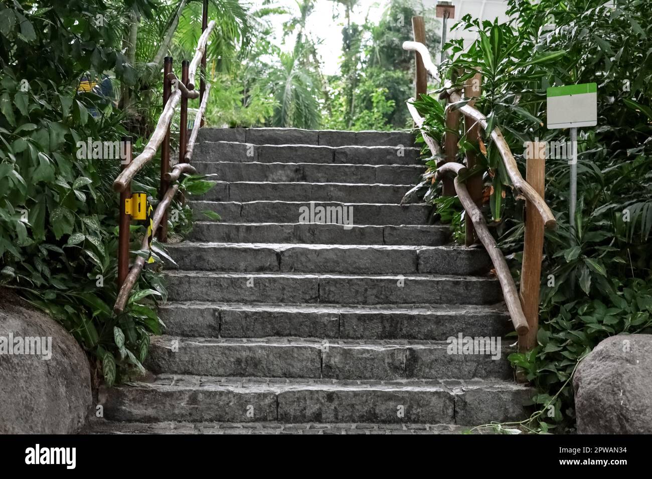 View of beautiful steps, sign board and plants in amusement park Stock ...