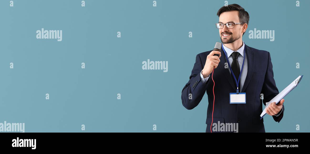 Male journalist with microphone and clipboard on blue background with ...