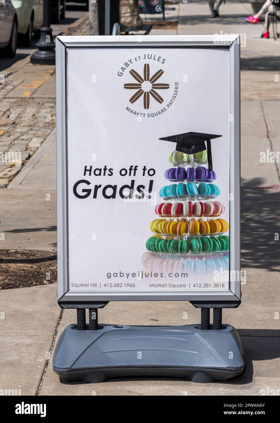 A placard for recent graduates outside of a pastry shop on Forbes ...