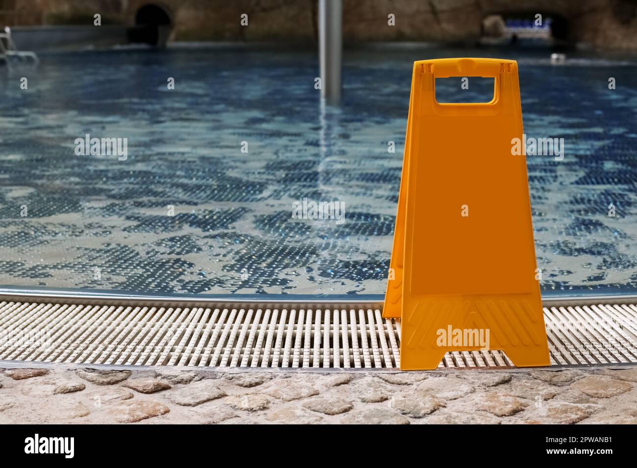 Caution sign near swimming pool in water park, closeup Stock Photo - Alamy