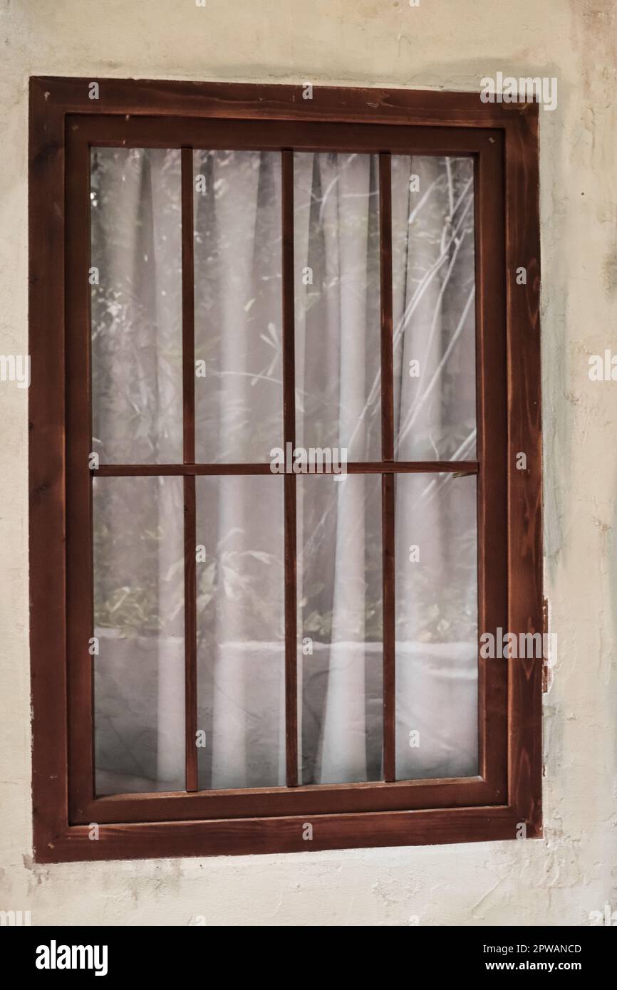 View of building with wooden window Stock Photo - Alamy