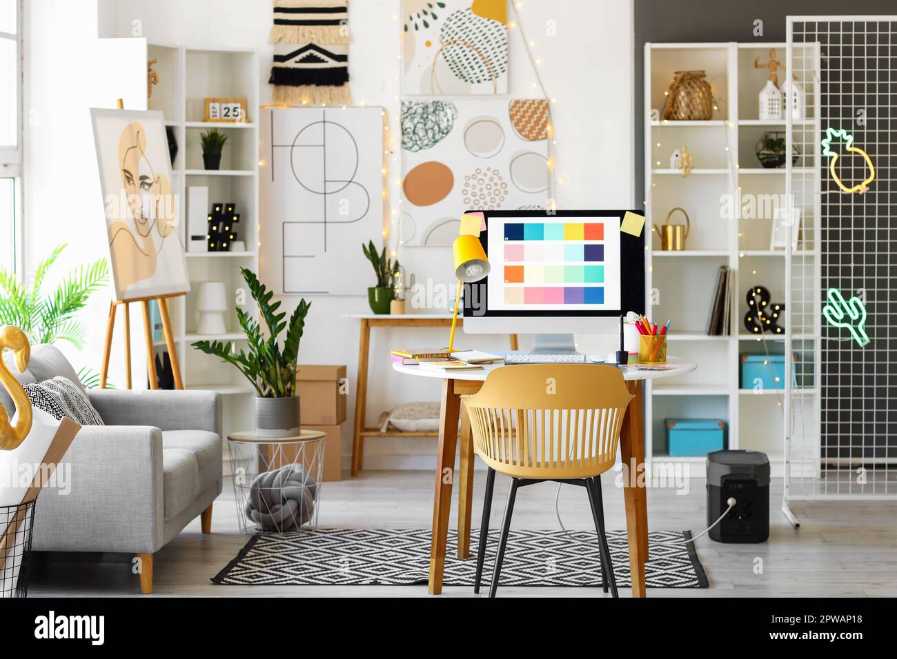 Interior of office with graphic designer's workplace and sofa Stock ...
