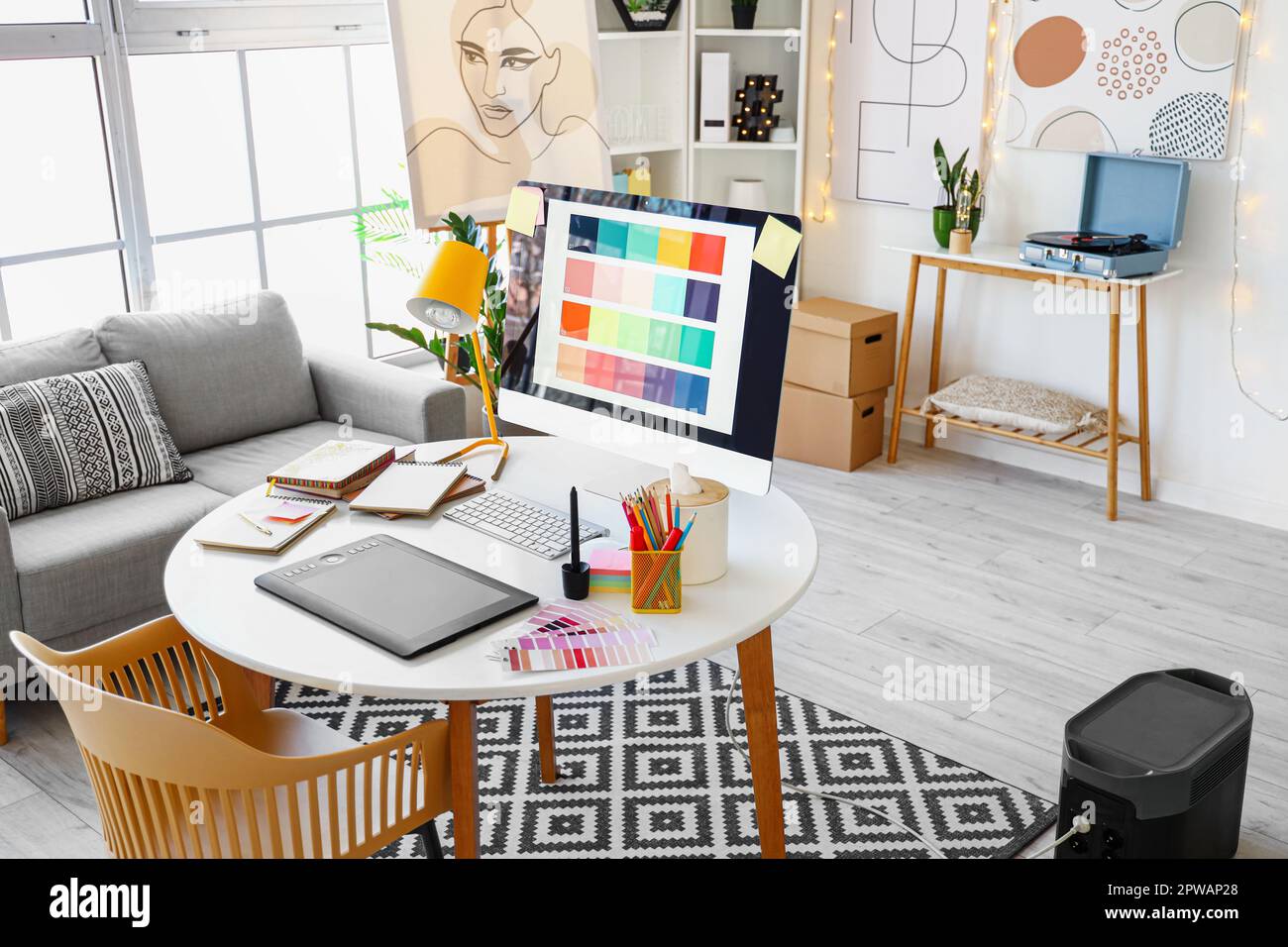 Interior of office with graphic designer's workplace and sofa Stock ...