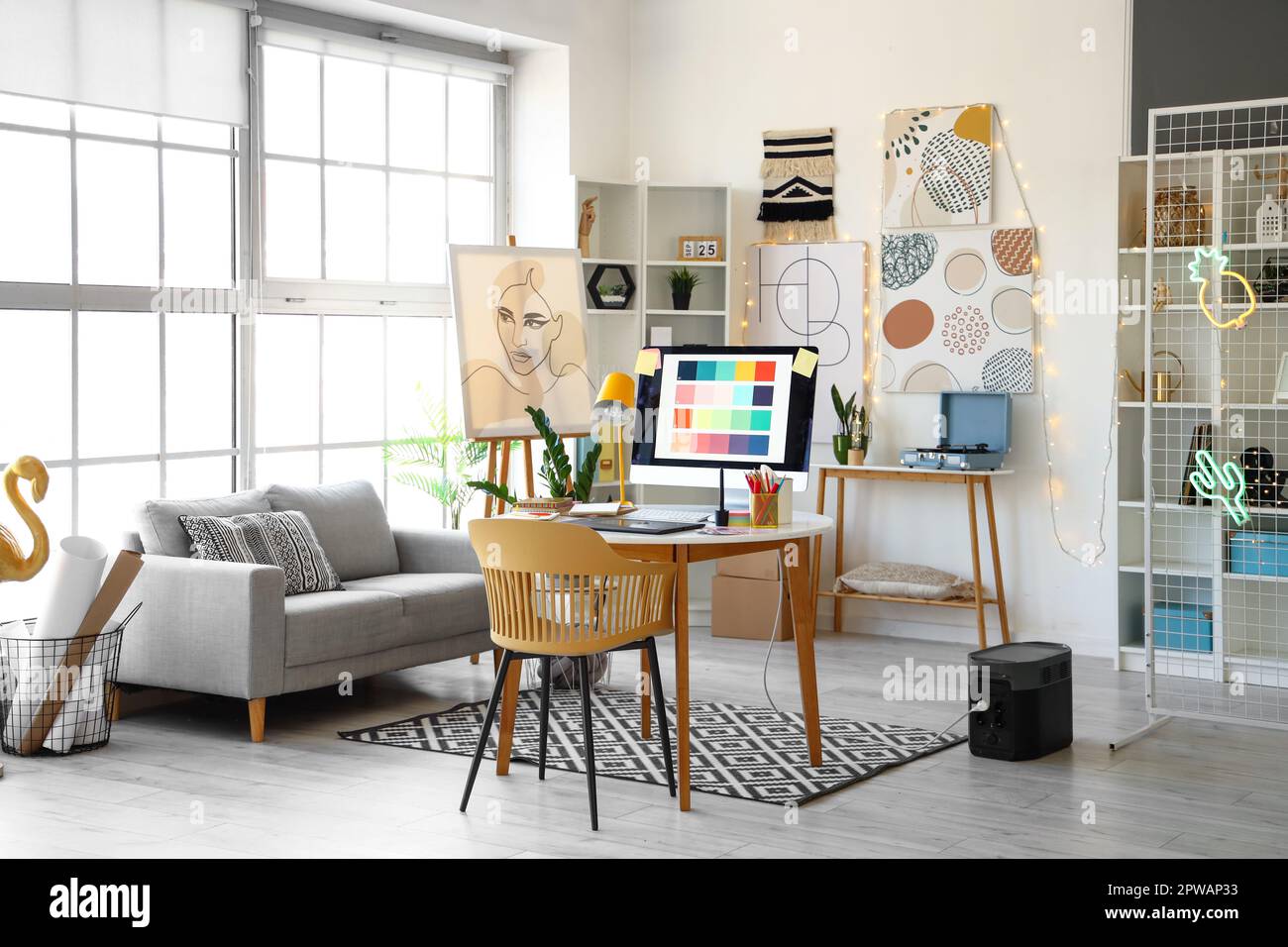 Interior of office with graphic designer's workplace and sofa Stock ...