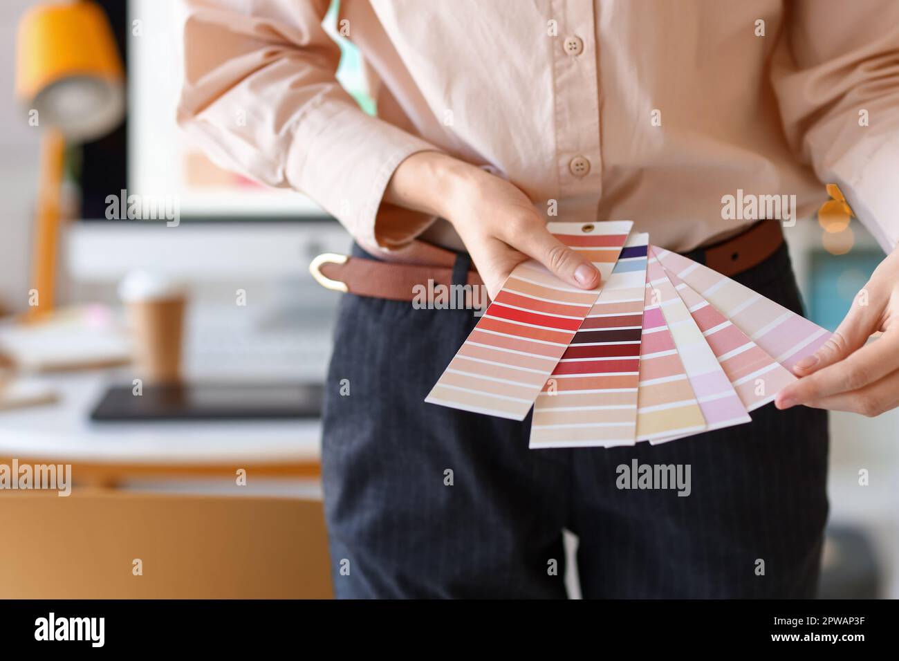 Female graphic designer with color palettes in office, closeup Stock ...