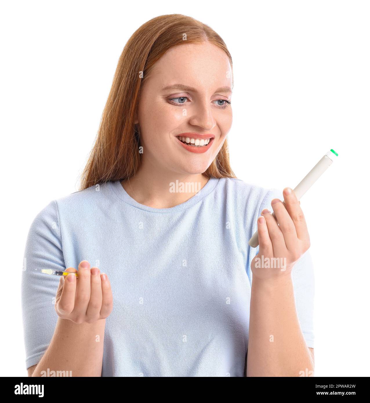 Woman with diabetes holding syringe for insulin injection and lancet ...