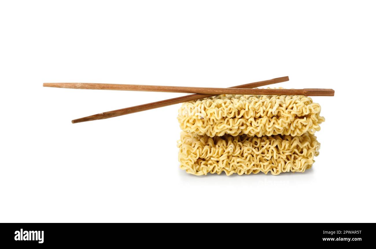 Raw instant noodles and wooden chopsticks on white background Stock ...