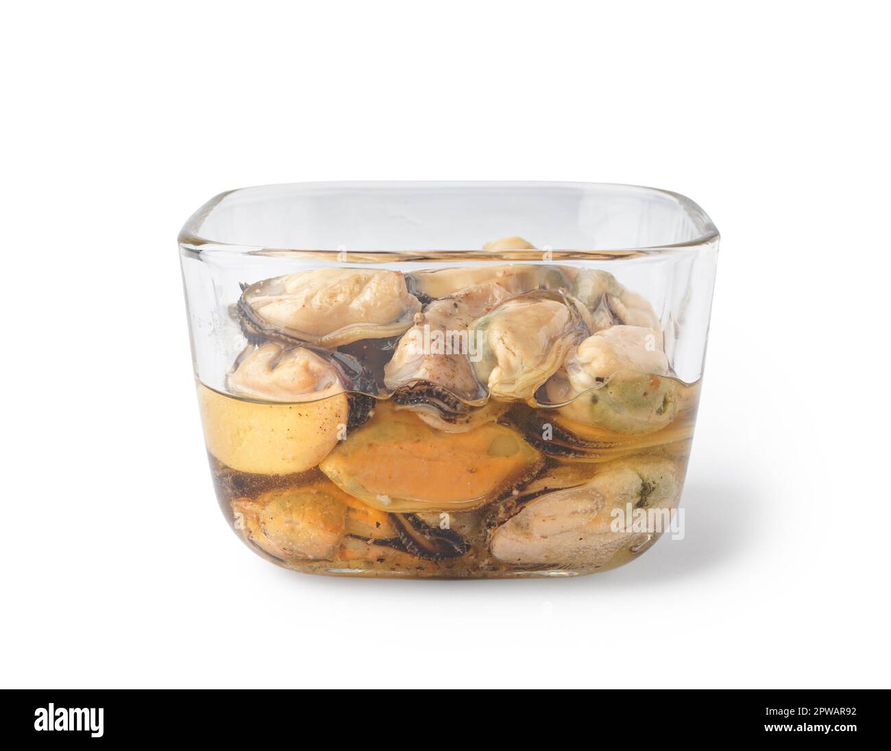 Marinated mussels in glass bowl on white background Stock Photo - Alamy